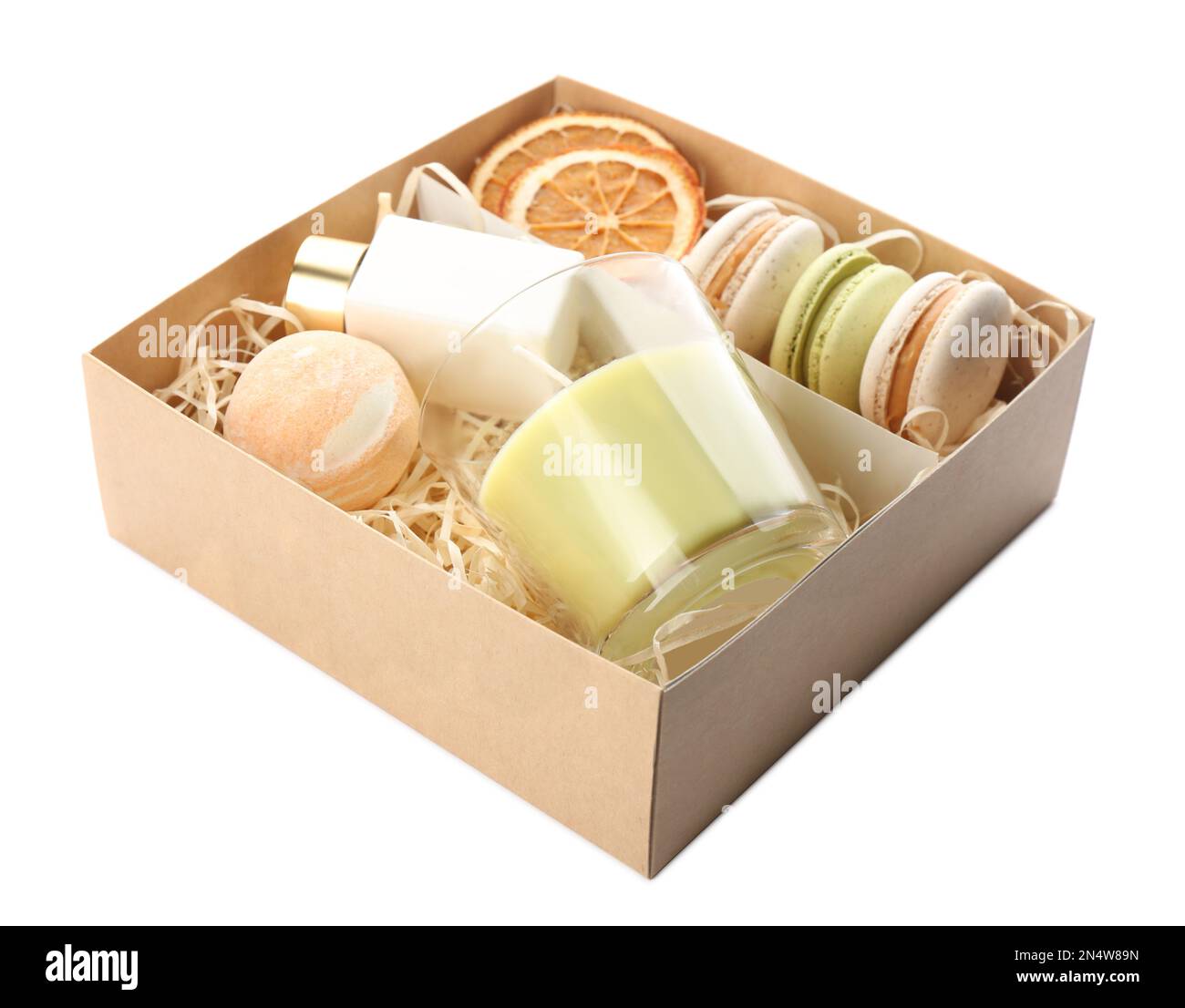 Gift set with candle and macarons in box on white background. Stylish ...