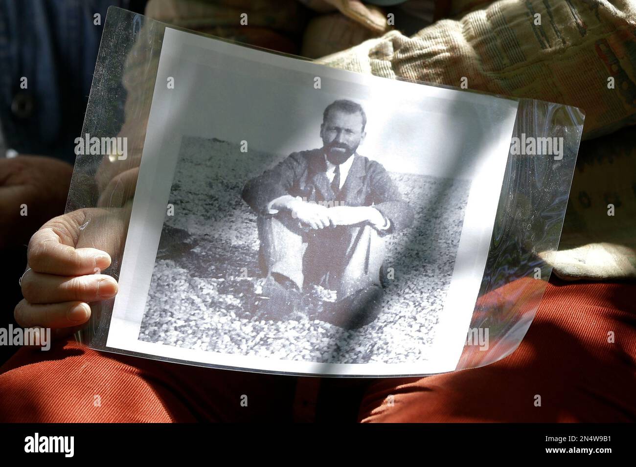 A photograph of conscientious objector Thomas Attlee is held by a ...