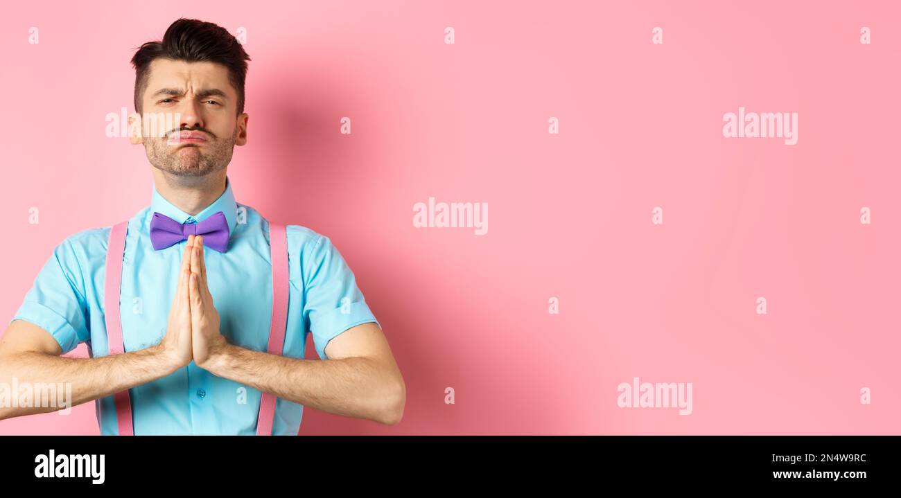 Silly guy making begging face, pleading and asking for help, standing ...