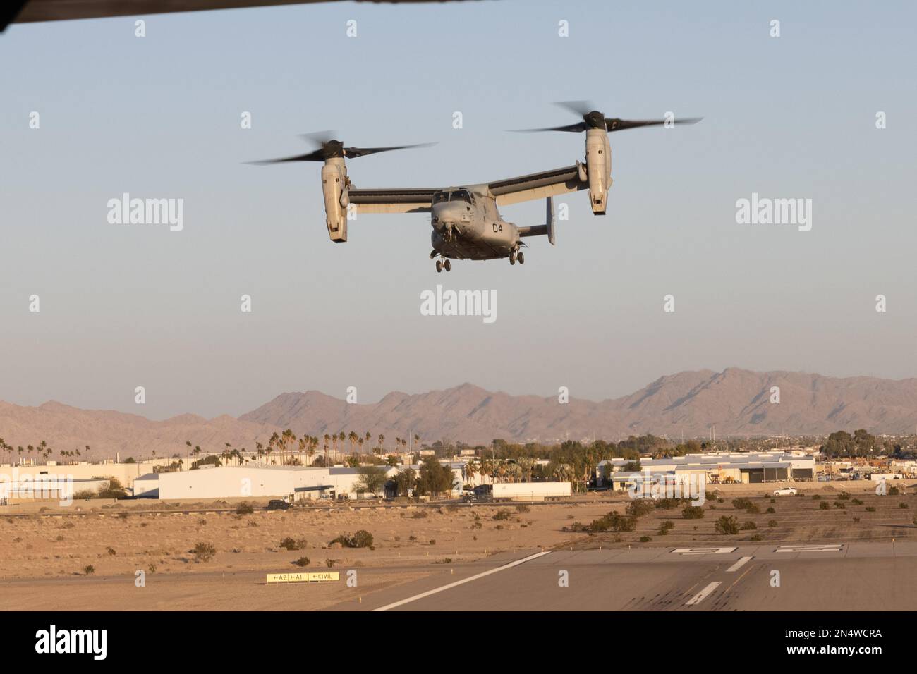 U.S. Marines with Marine Medium Tiltrotor Squadron (VMM) 261 fly an MV ...