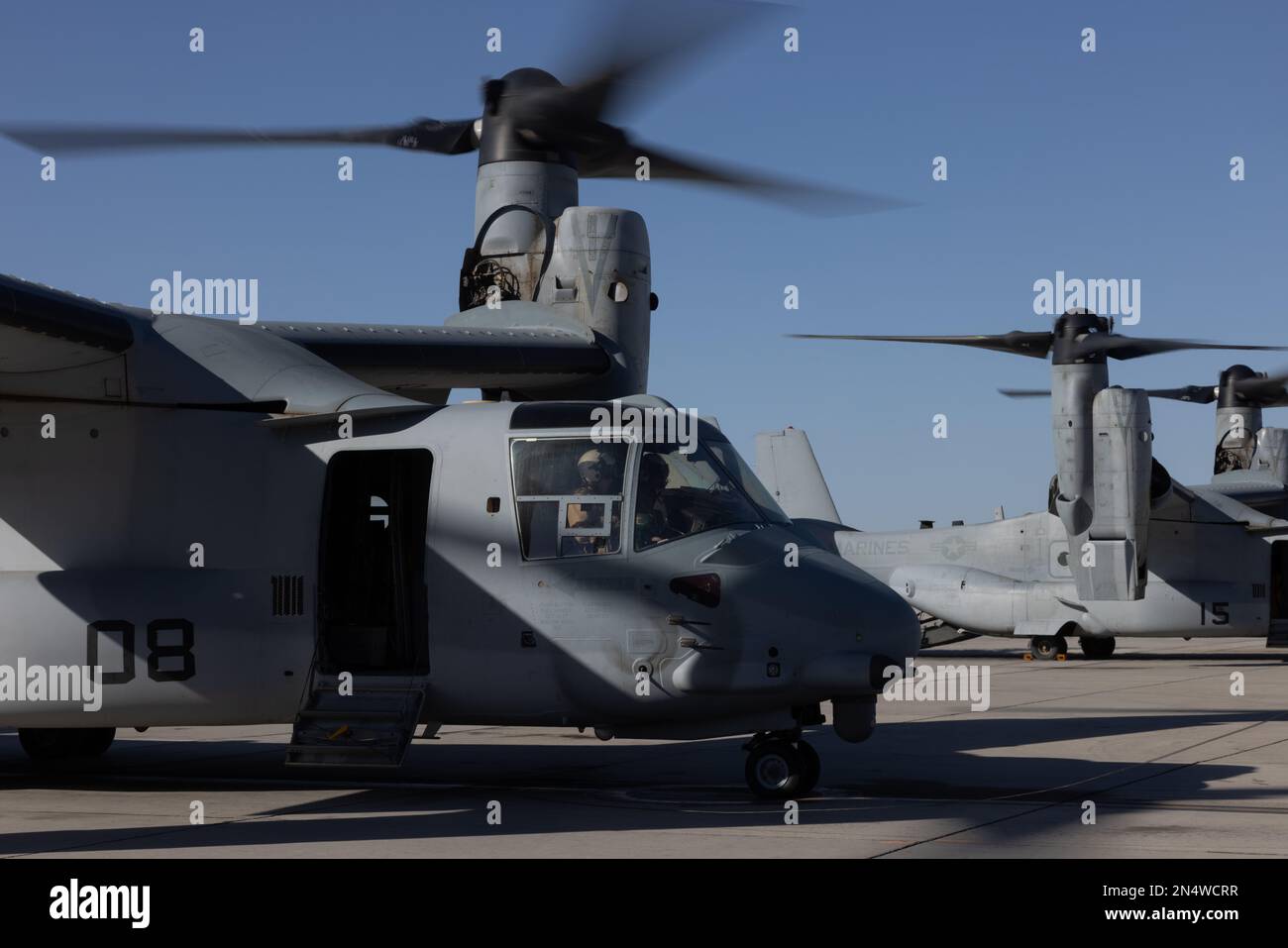 U.S. Marines with Marine Medium Tiltrotor Squadron (VMM) 261 prepare an MV-22B Osprey for ...