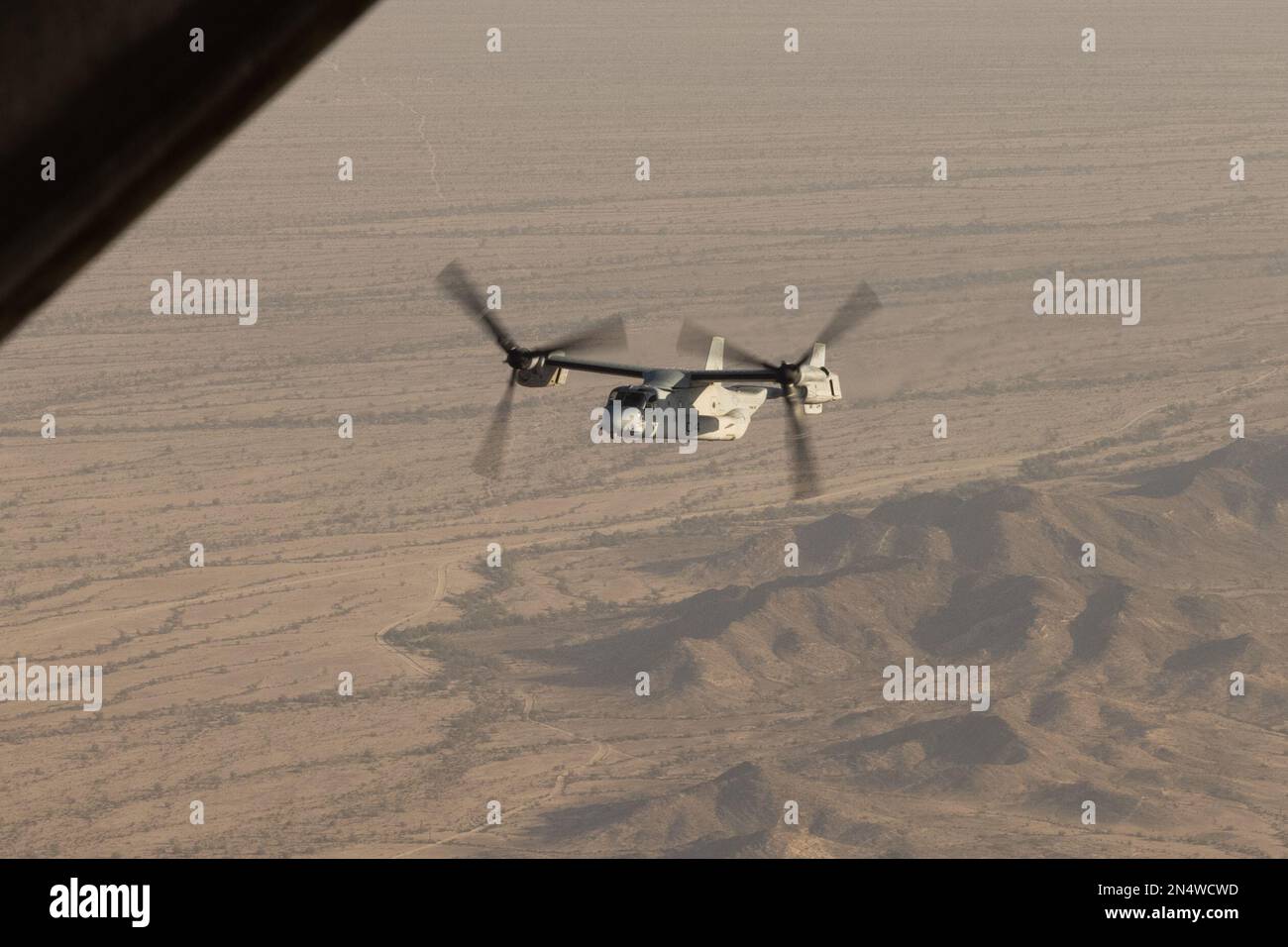 U.S. Marines with Marine Medium Tiltrotor Squadron (VMM) 261 fly an MV ...