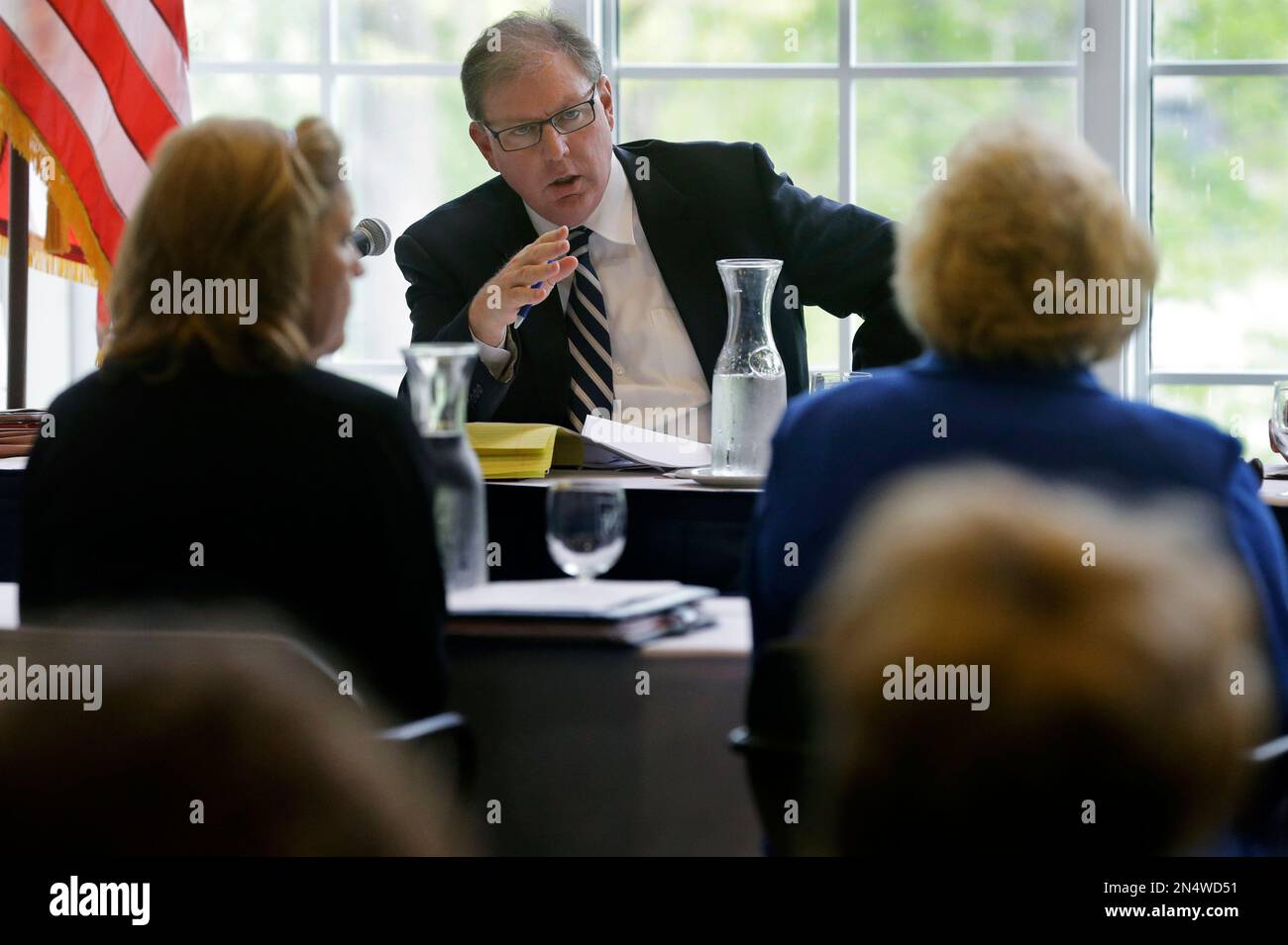 New Jersey Assemblyman Joseph Cryan, center, D-Union, N.J., asks a ...