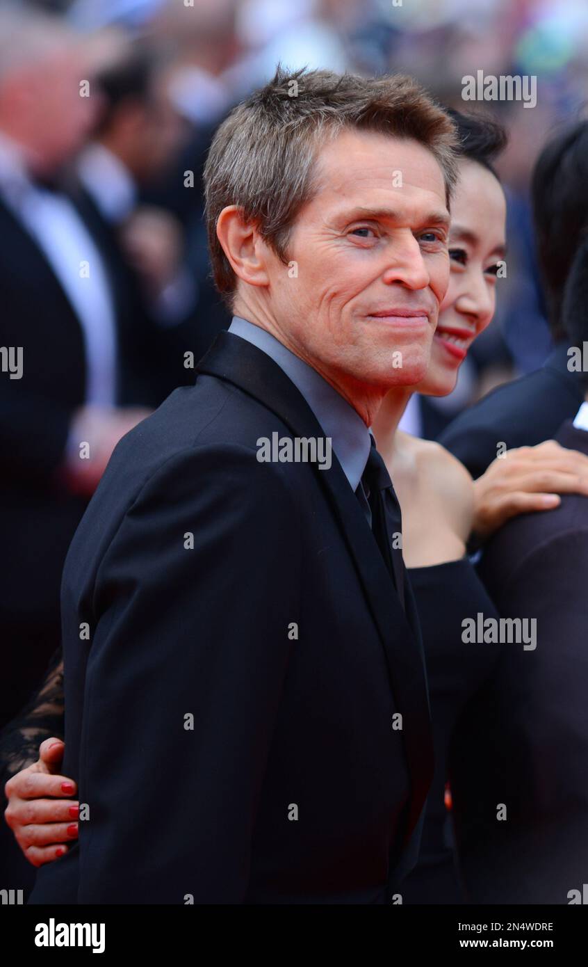 Willem Dafoe poses on the red carpet for the opening ceremony and the ...