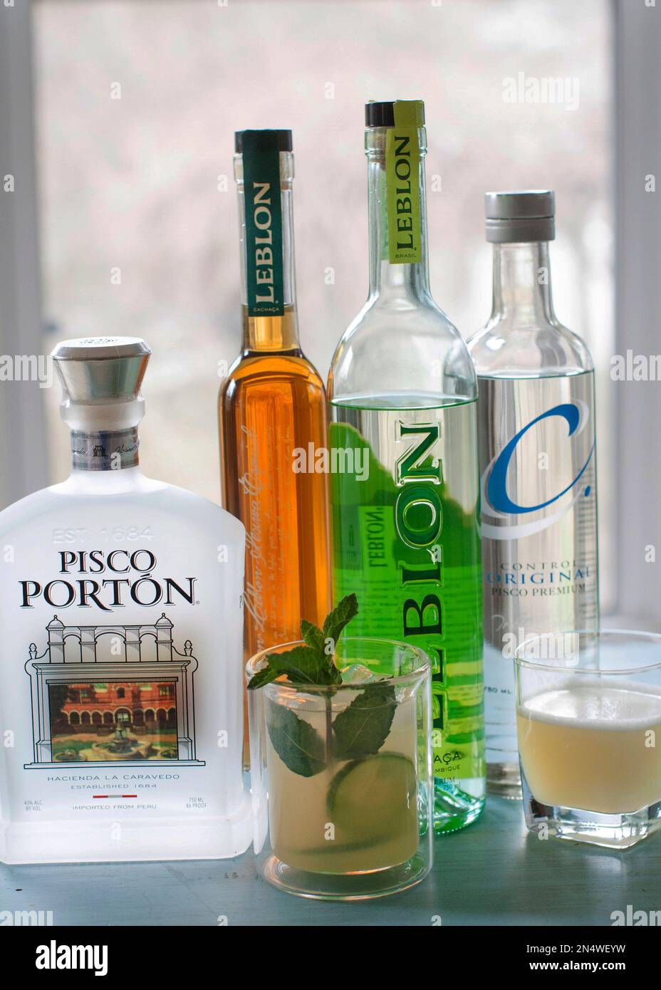 This April 28, 2014 photo shows, from left, Pisco Portion, Leblon ...