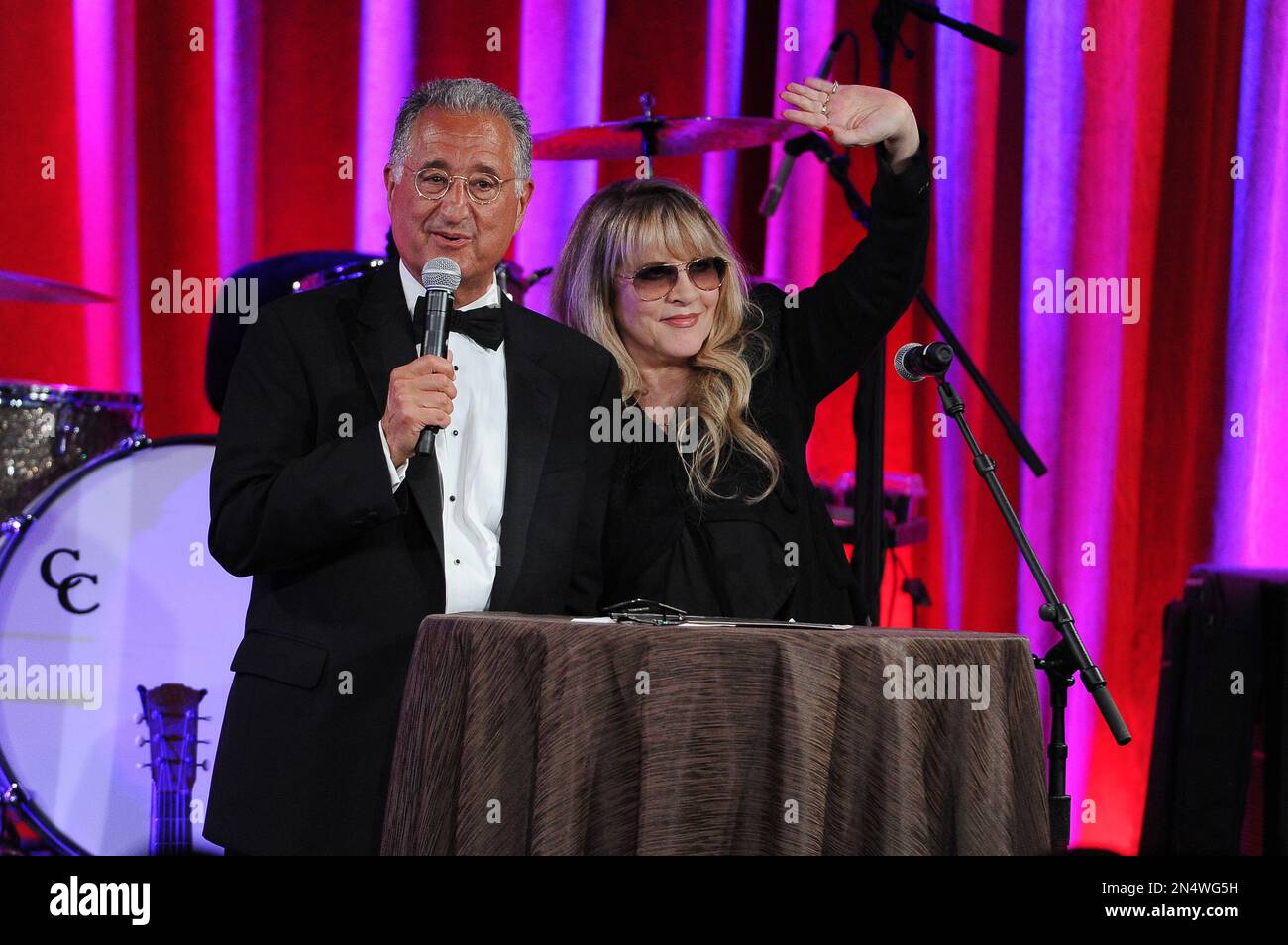 Del Bryant, BMI president, left, and Stevie Nicks speak on stage at the ...