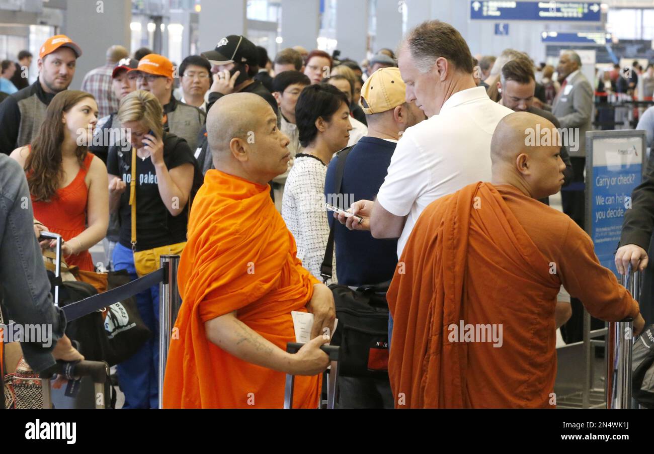 Chris Alguire, from Dallas, Texas, white shirt, makes a business call ...