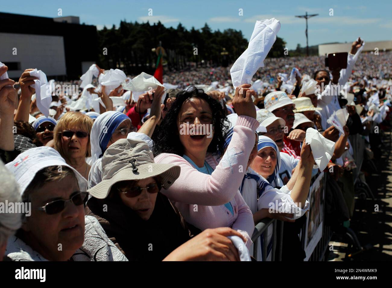 The faithful wave white handkerchiefs at the end of a mass at the Our ...