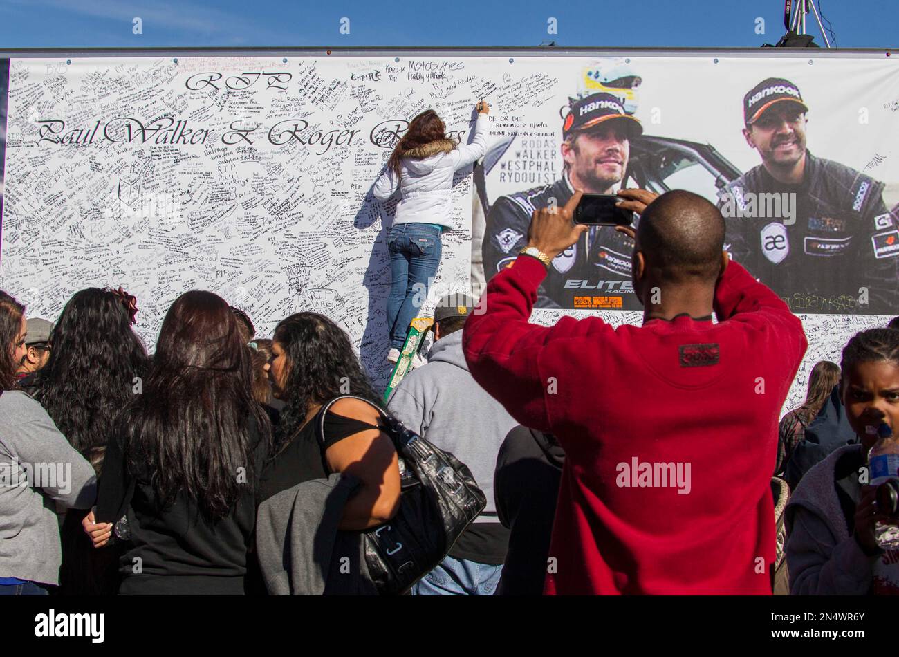 FILE - In this Dec. 8, 2013 file photo, fans crowd the scene of a ...