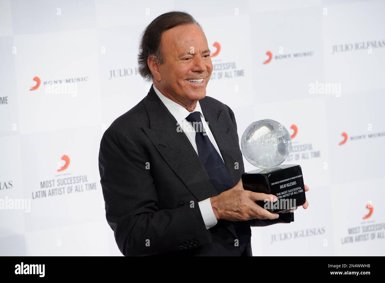 Spanish singer Julio Iglesias poses for photographers at a press ...