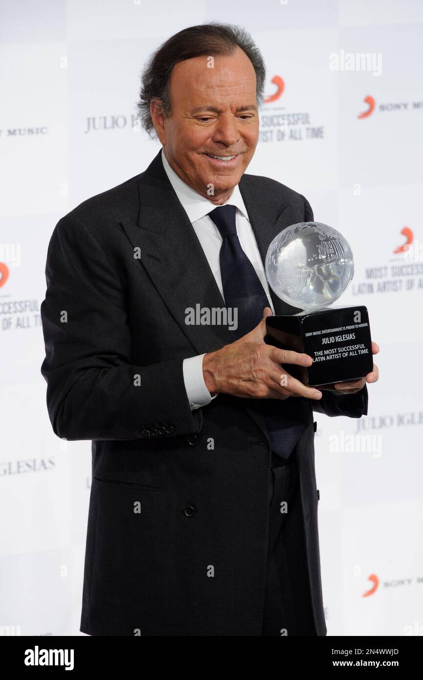 Spanish singer Julio Iglesias poses for photographers at a press ...