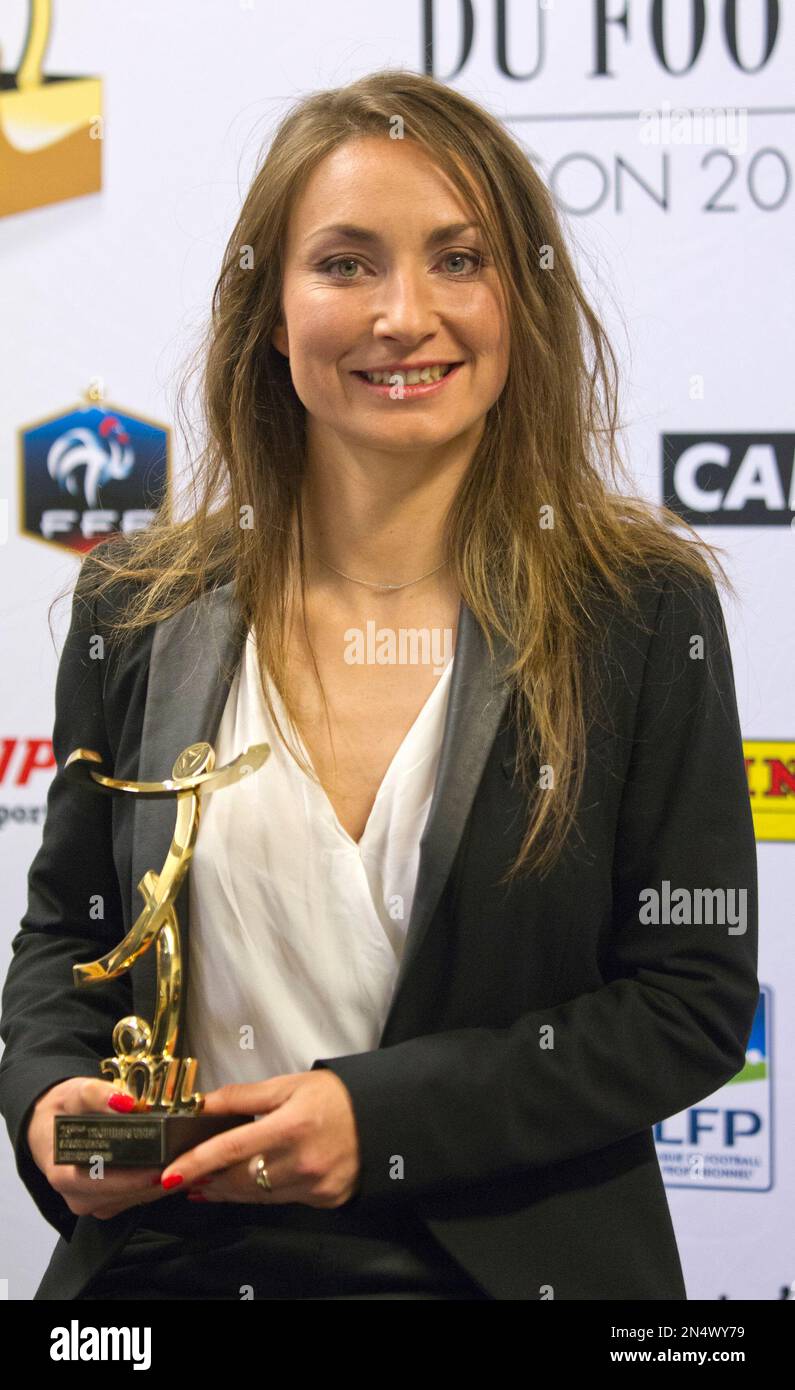 French forward Gaetane Thiney of Juvisy poses with her award for the ...