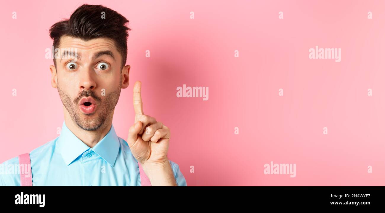 Close-up of excited guy pitching an idea, raising finger and saying ...