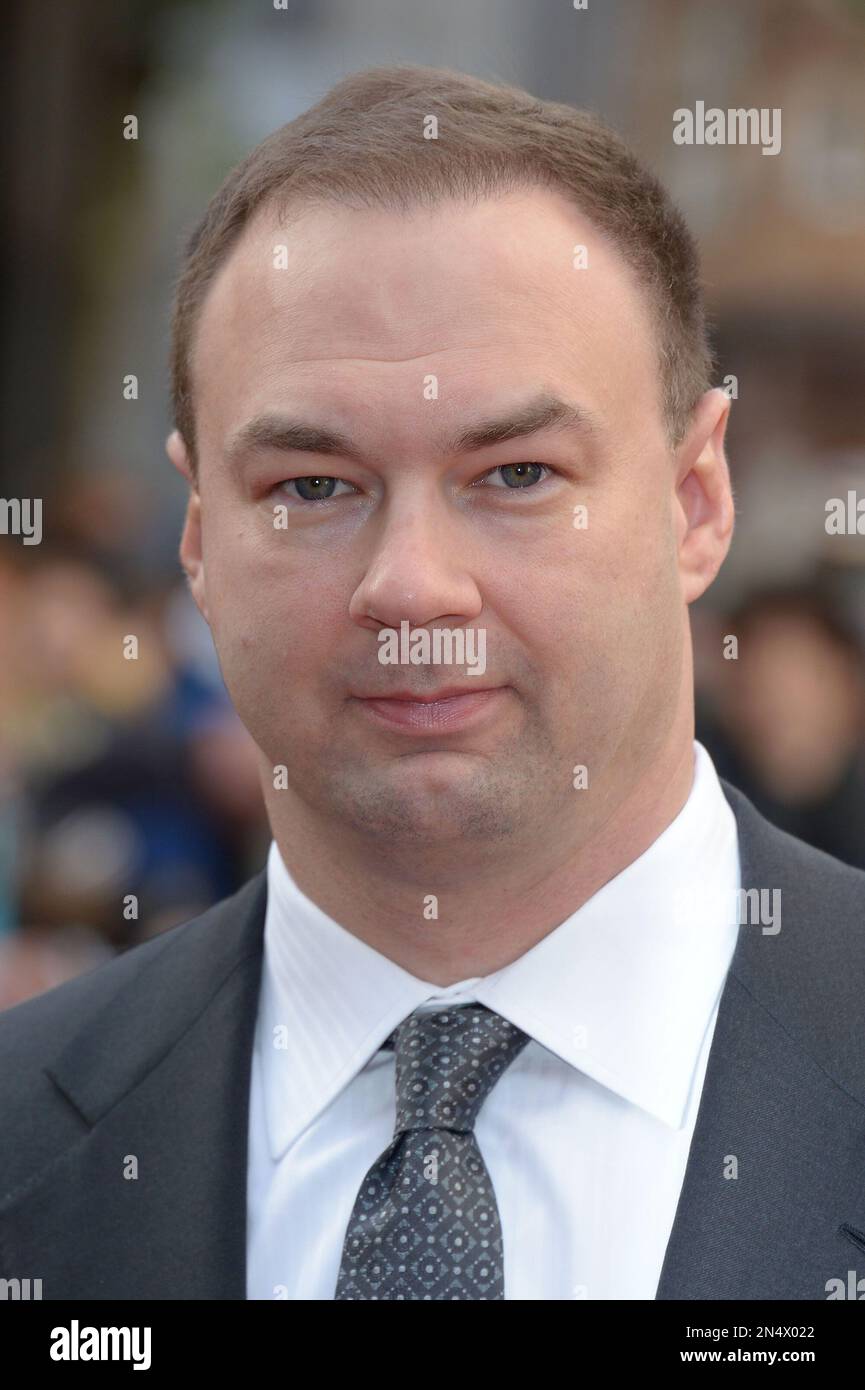 Producer Thomas Tull poses for photographers on the red carpet for the ...