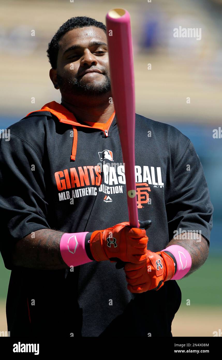 San Francisco Giants' Pablo Sandoval checks out his pink bat during ...