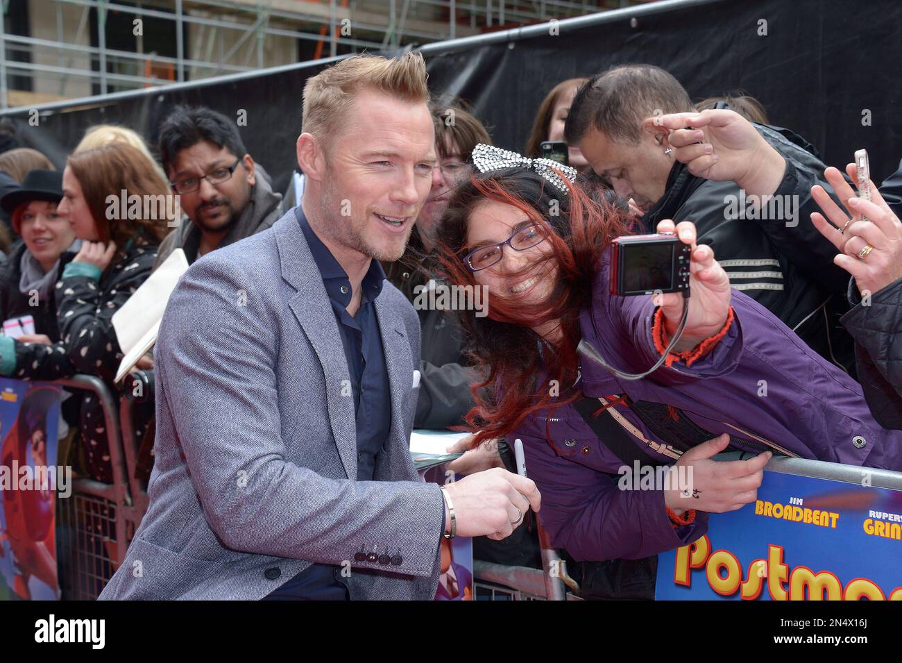 Irish singer Ronan Keating poses for pictures with fans on the red ...