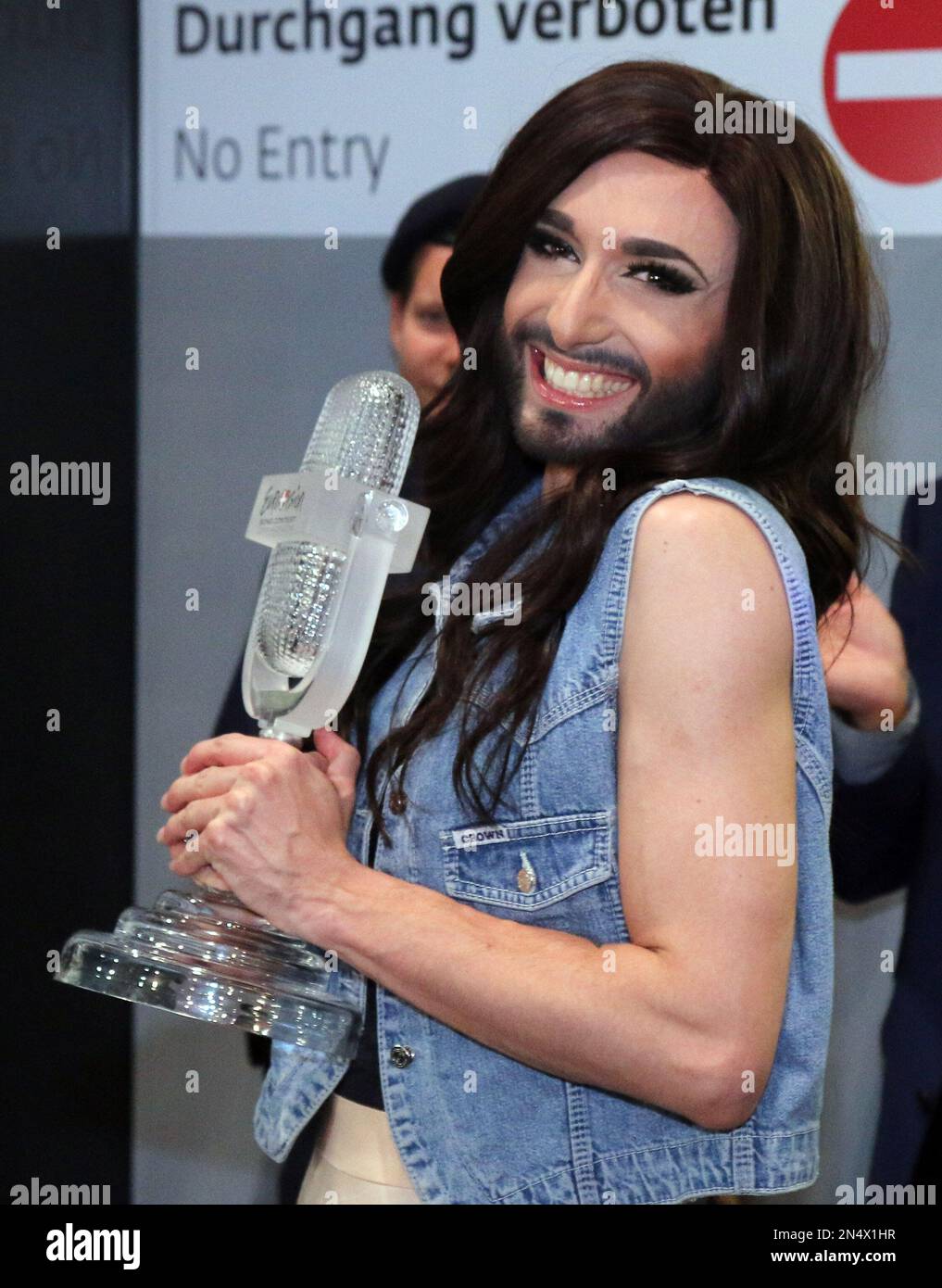 Austrian singer Conchita Wurst arrives with the trophy at the airport ...