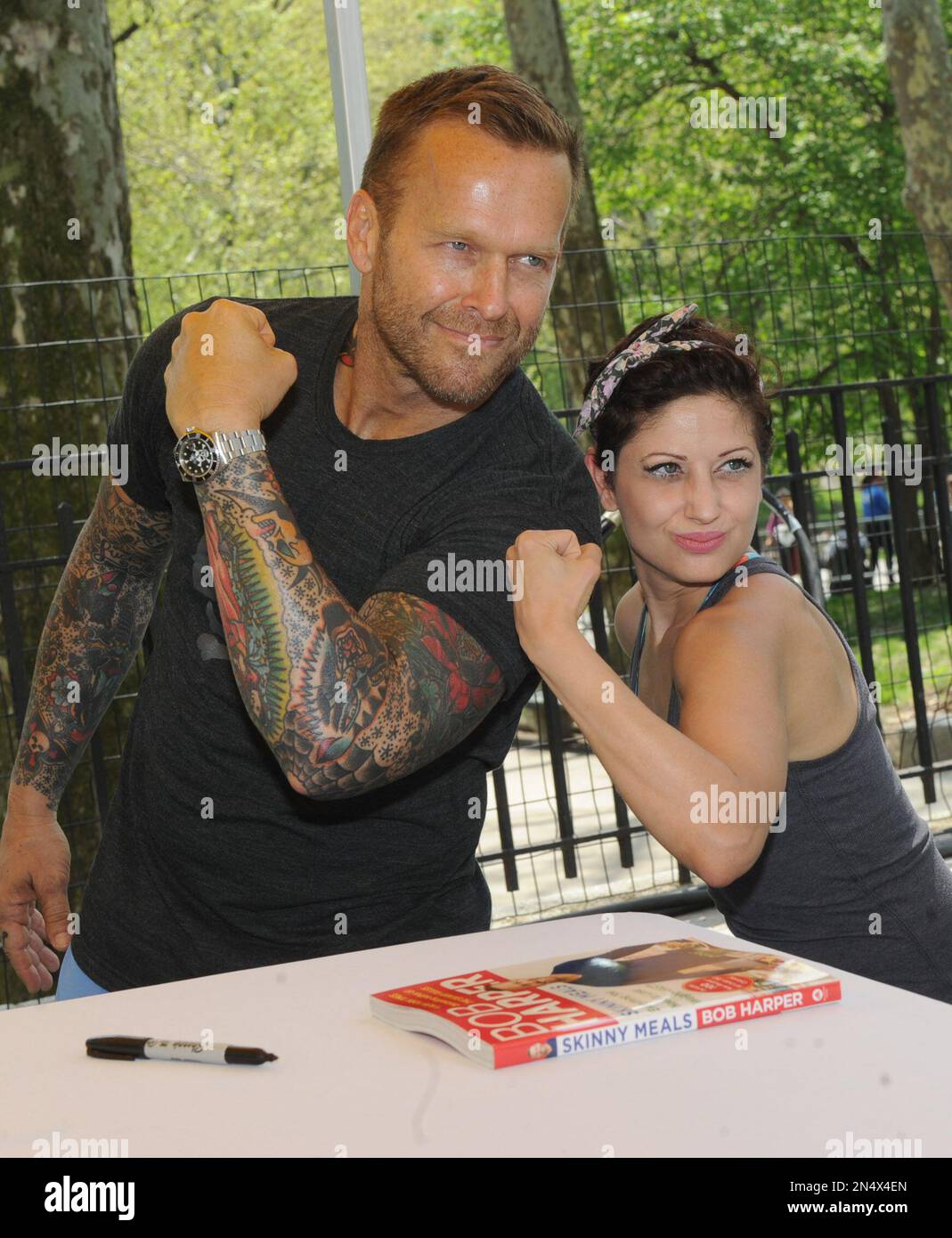 Bob Harper, trainer on "The Biggest Loser," flexes with a fan at SELF ...