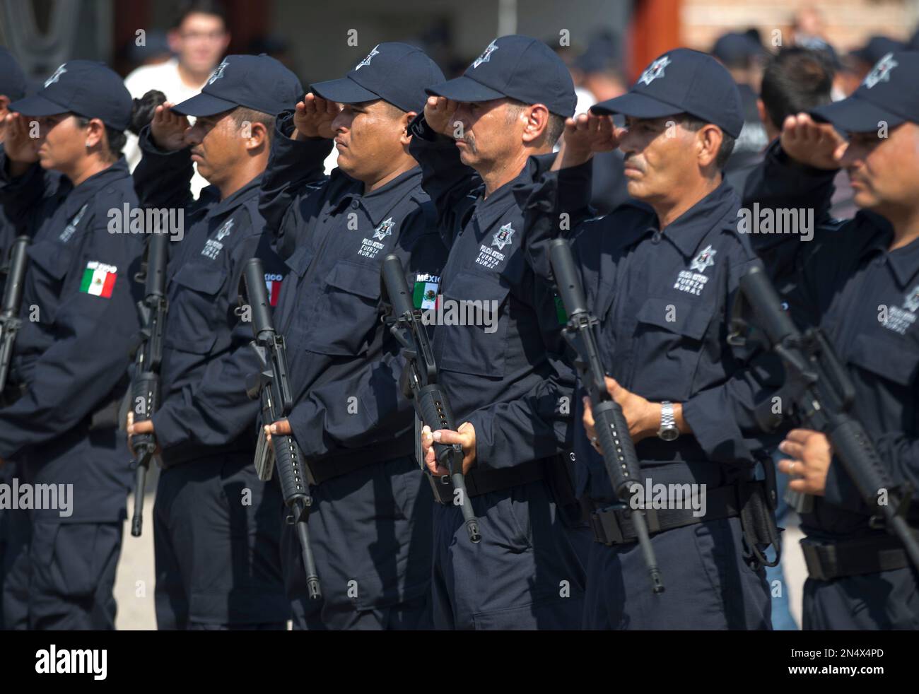 Self-defense group members wearing their newly-issued police uniforms ...