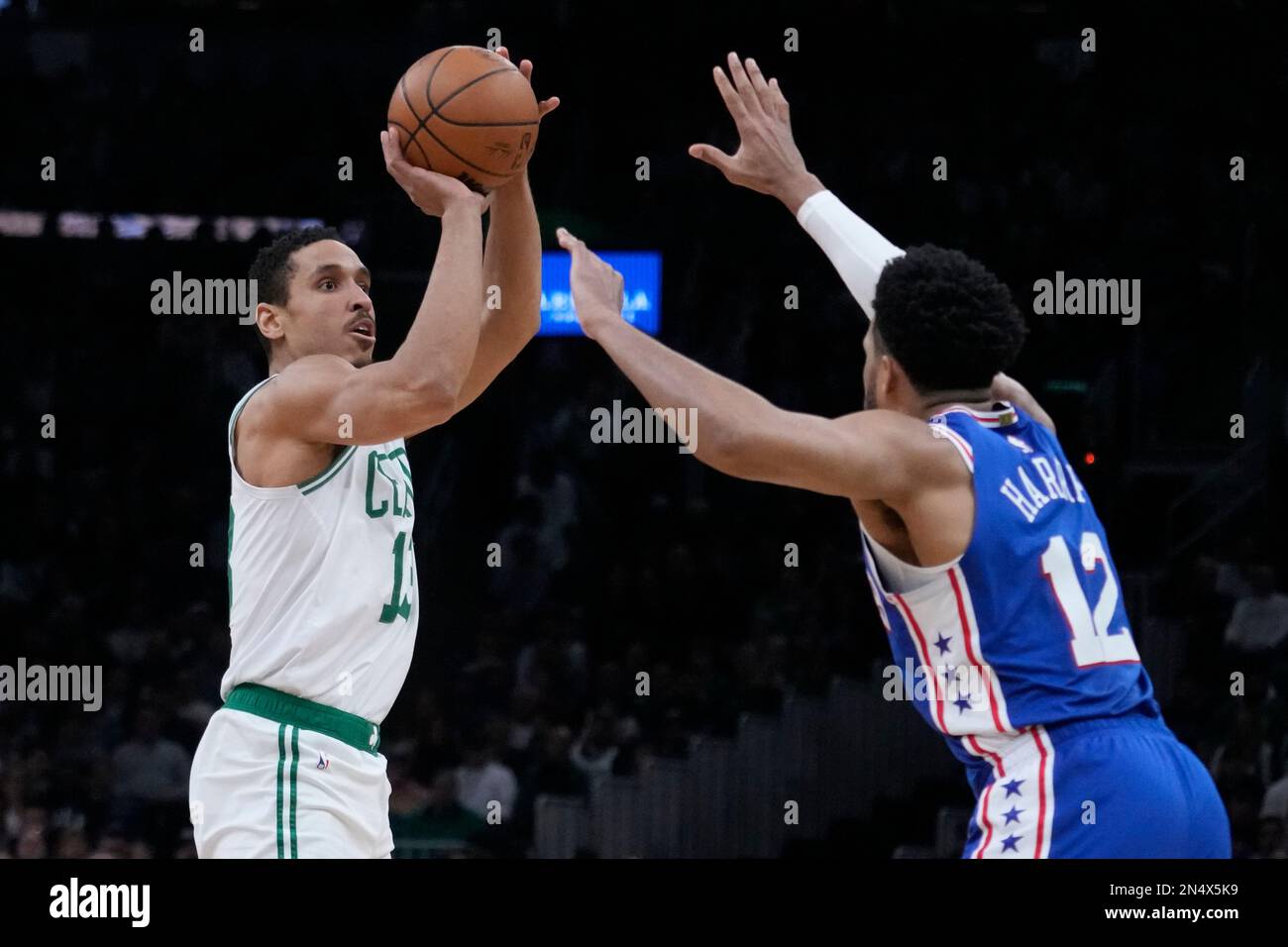 Boston Celtics guard Malcolm Brogdon (13) shoots over Philadelphia ...