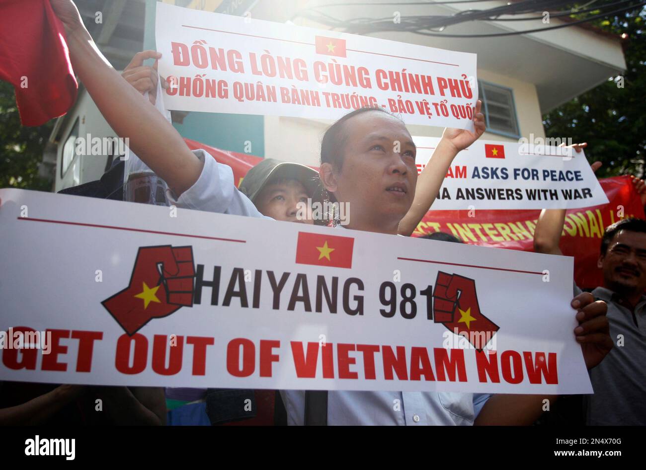 Vietnamese protesters hold banners during a protest rally against China ...