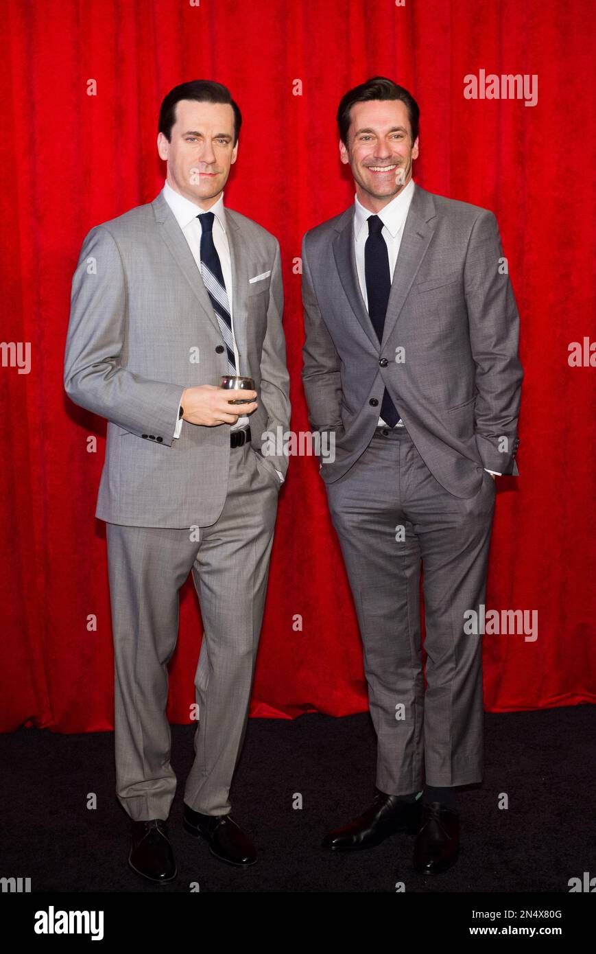 Jon Hamm, right, poses with his wax likeness at its unveiling at Madame ...
