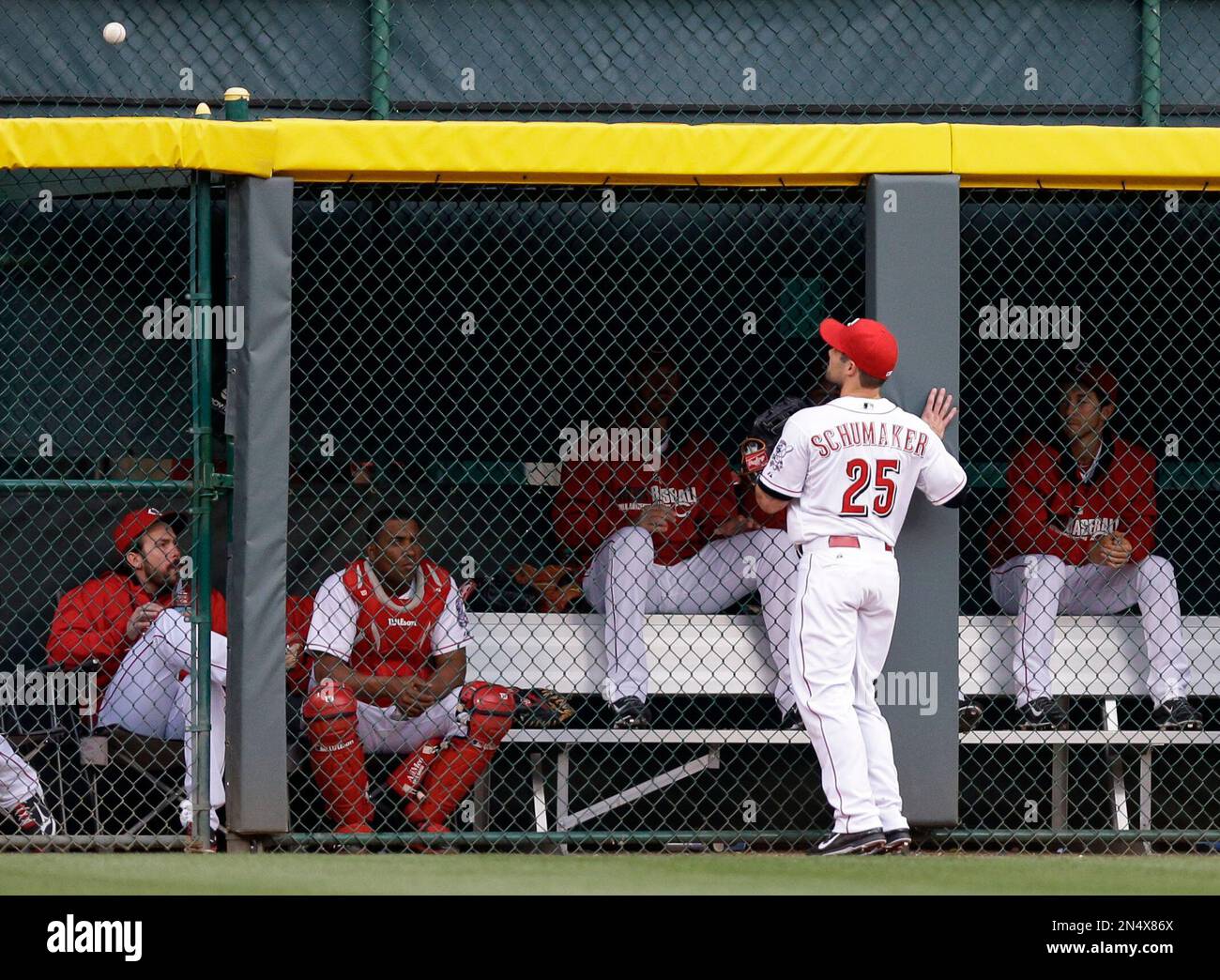 Cincinnati Reds left fielder Skip Schumaker (25) watches a home run hit ...