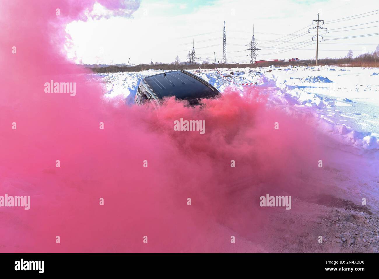 An off- road car glides down the mountain in strong puffs of ...