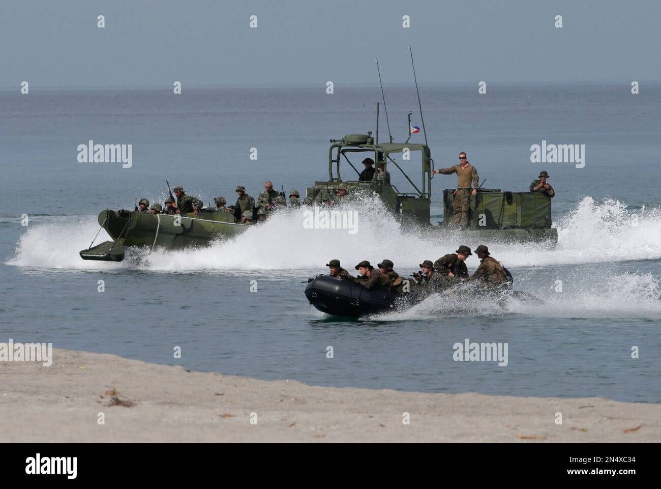 U.S. and Philippine marines storm the beach to simulate an amphibious ...