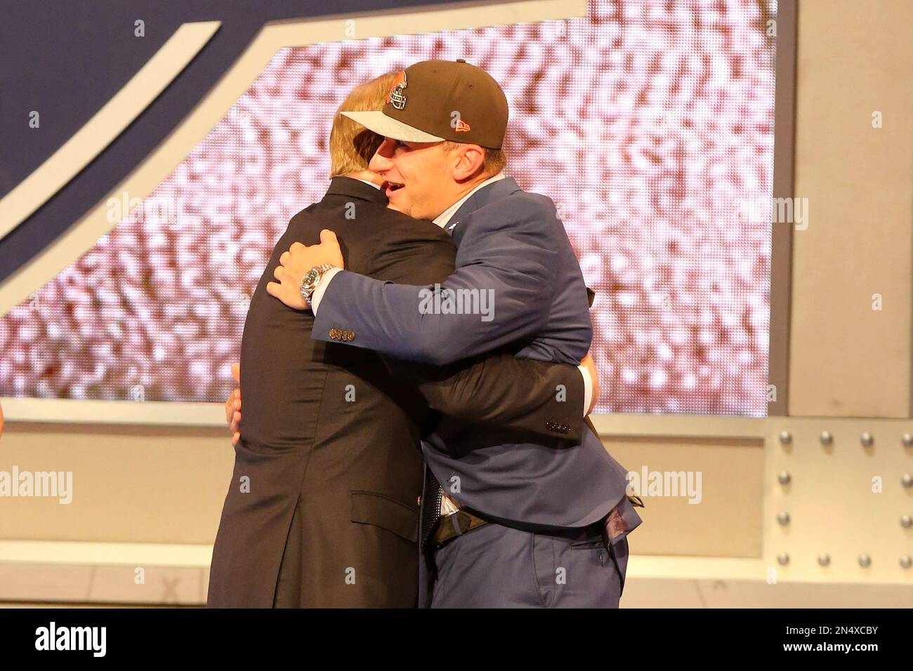 Johnny Manziel hugs NFL Commissioner Roger Goodell after being selected ...
