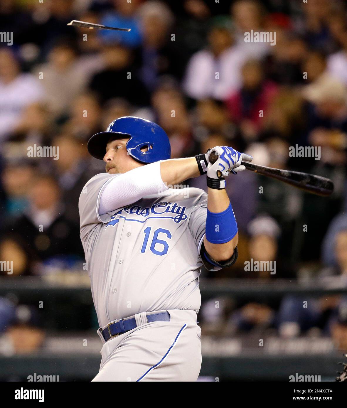 A piece of Kansas City Royals' Billy Butler's bat flies over his head ...