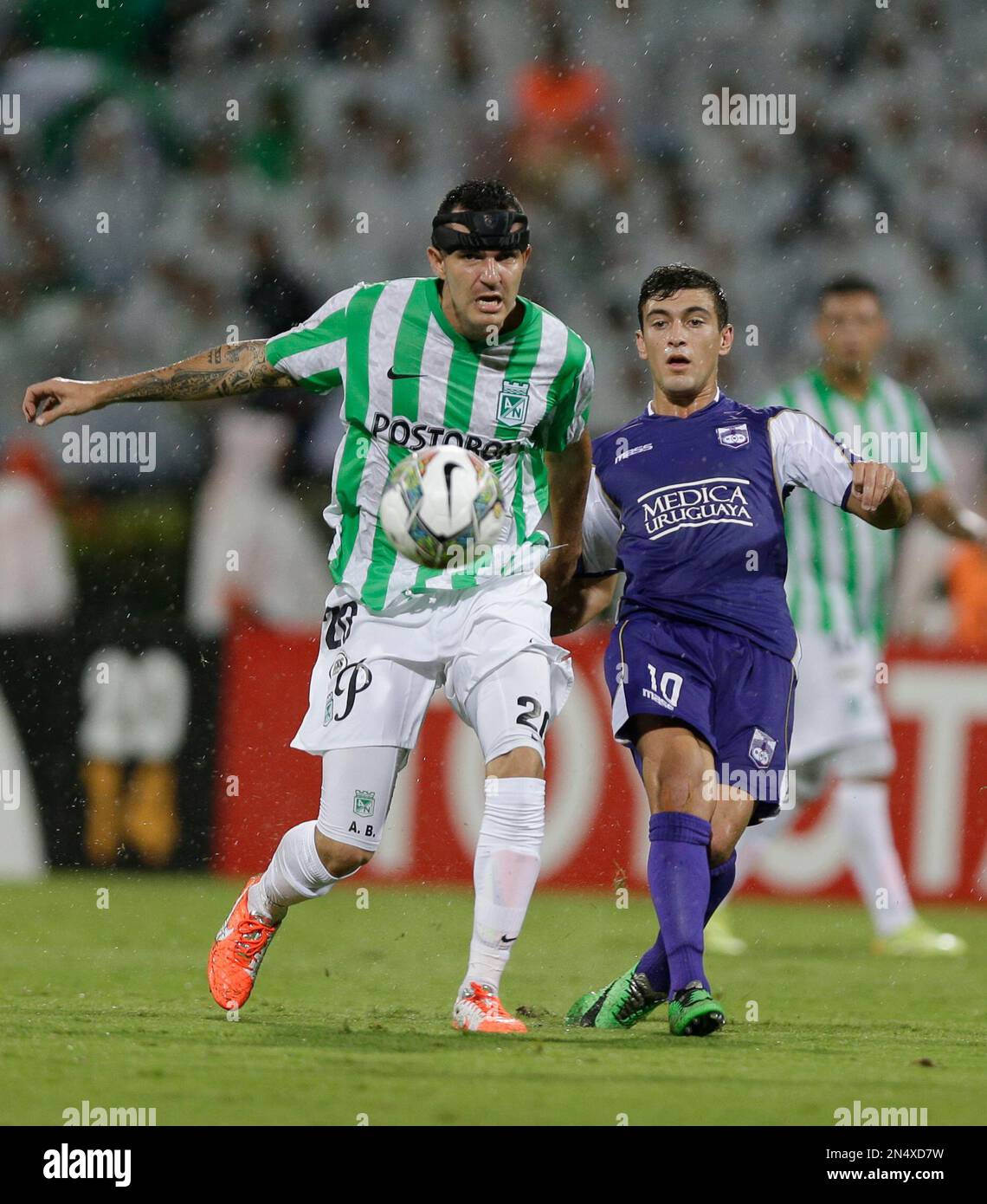 Alex Bernal, of Colombia's Atletico Nacional, left, and Giorgian De ...