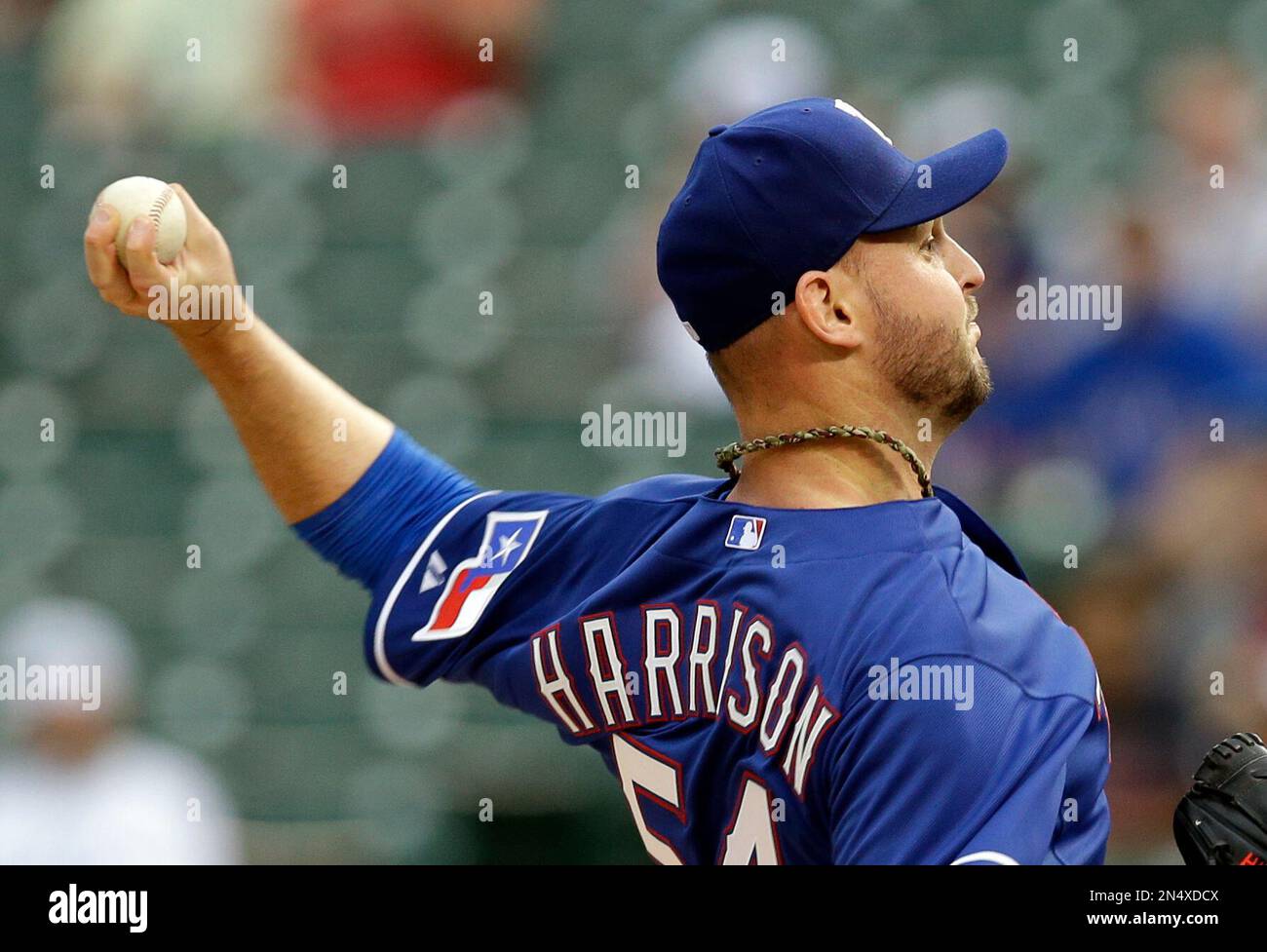Texas Rangers starting pitcher Matt Harrison (54) works against the ...