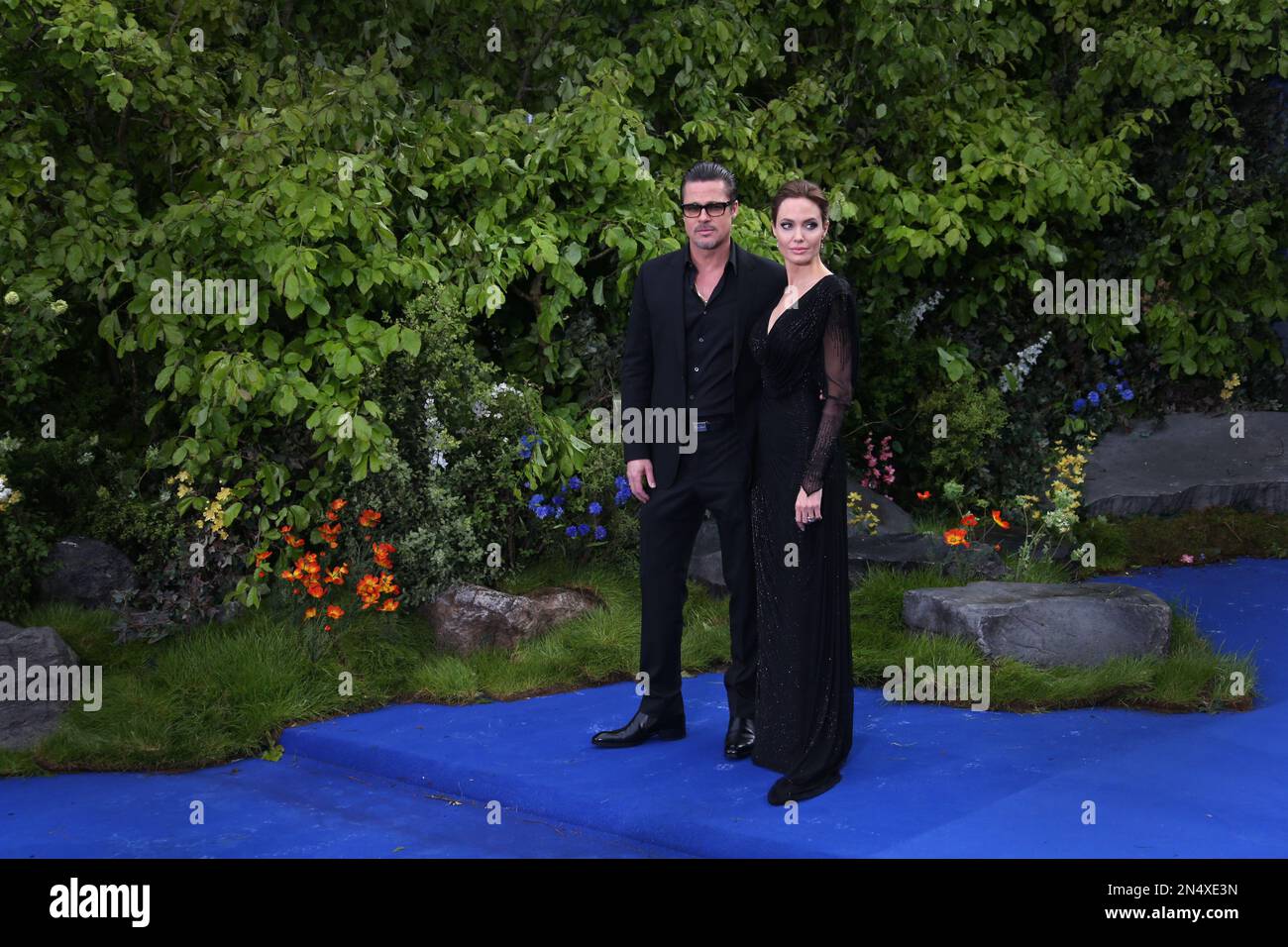 Actors Brad Pitt and Angelina Jolie pose for photographers as they ...