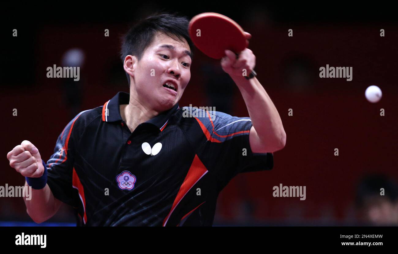 Huang Sheng-sheng of Taiwan returns a shot during his semifinal match ...