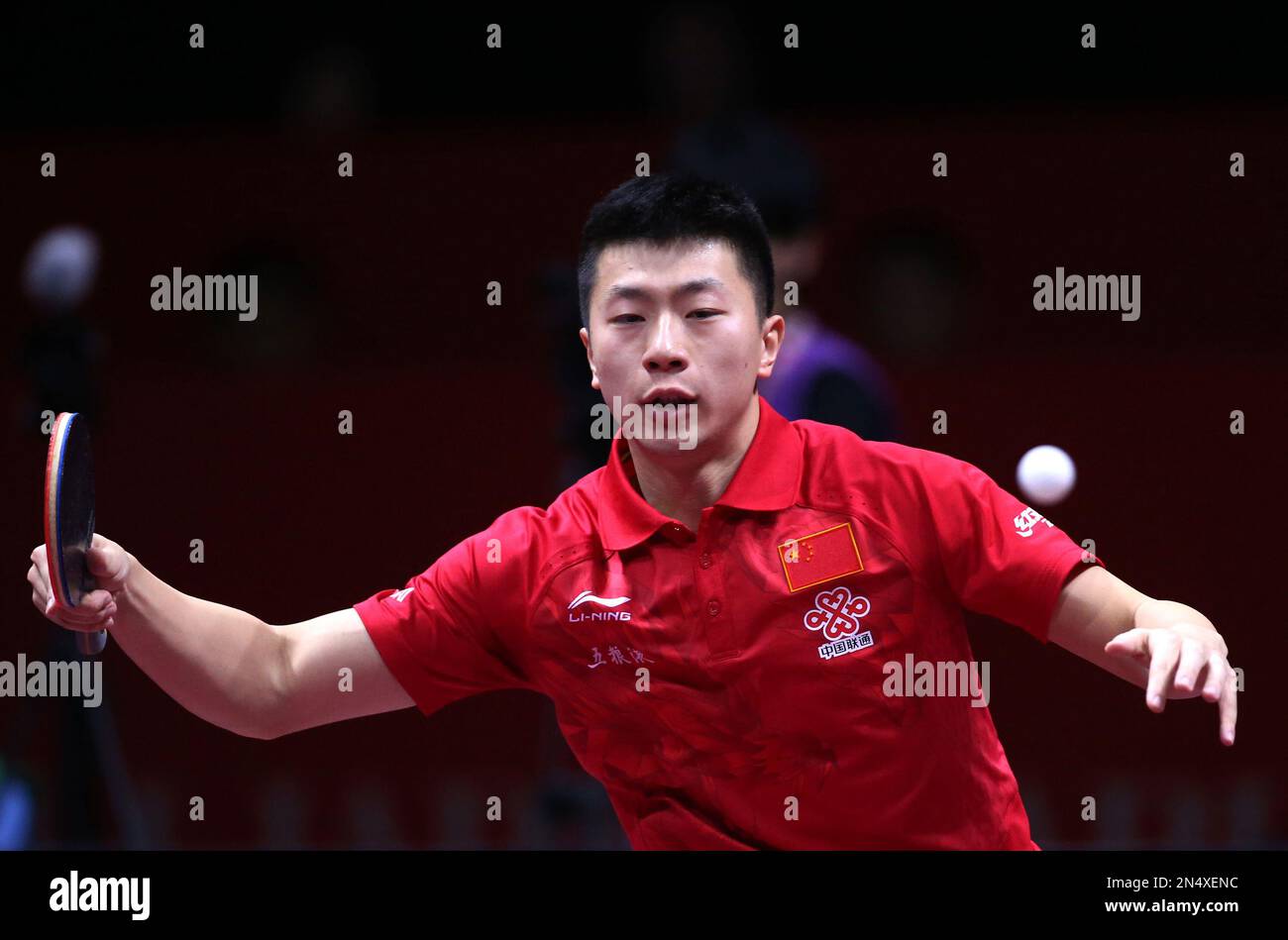 Ma Long of China watches the ball during his semifinal match of the ...
