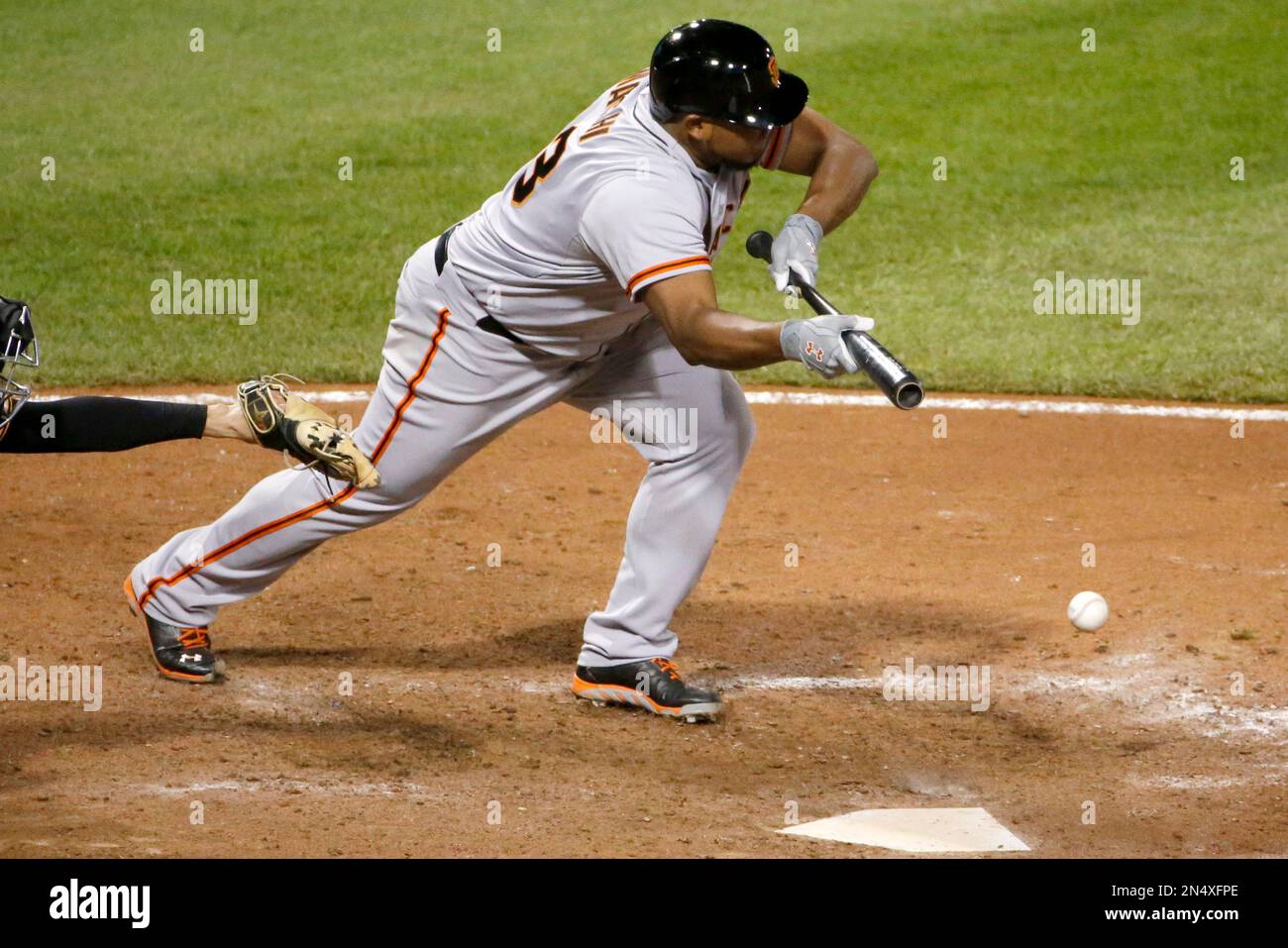 San Francisco Giants' Jean Machi lays down a bunt during the 13th ...