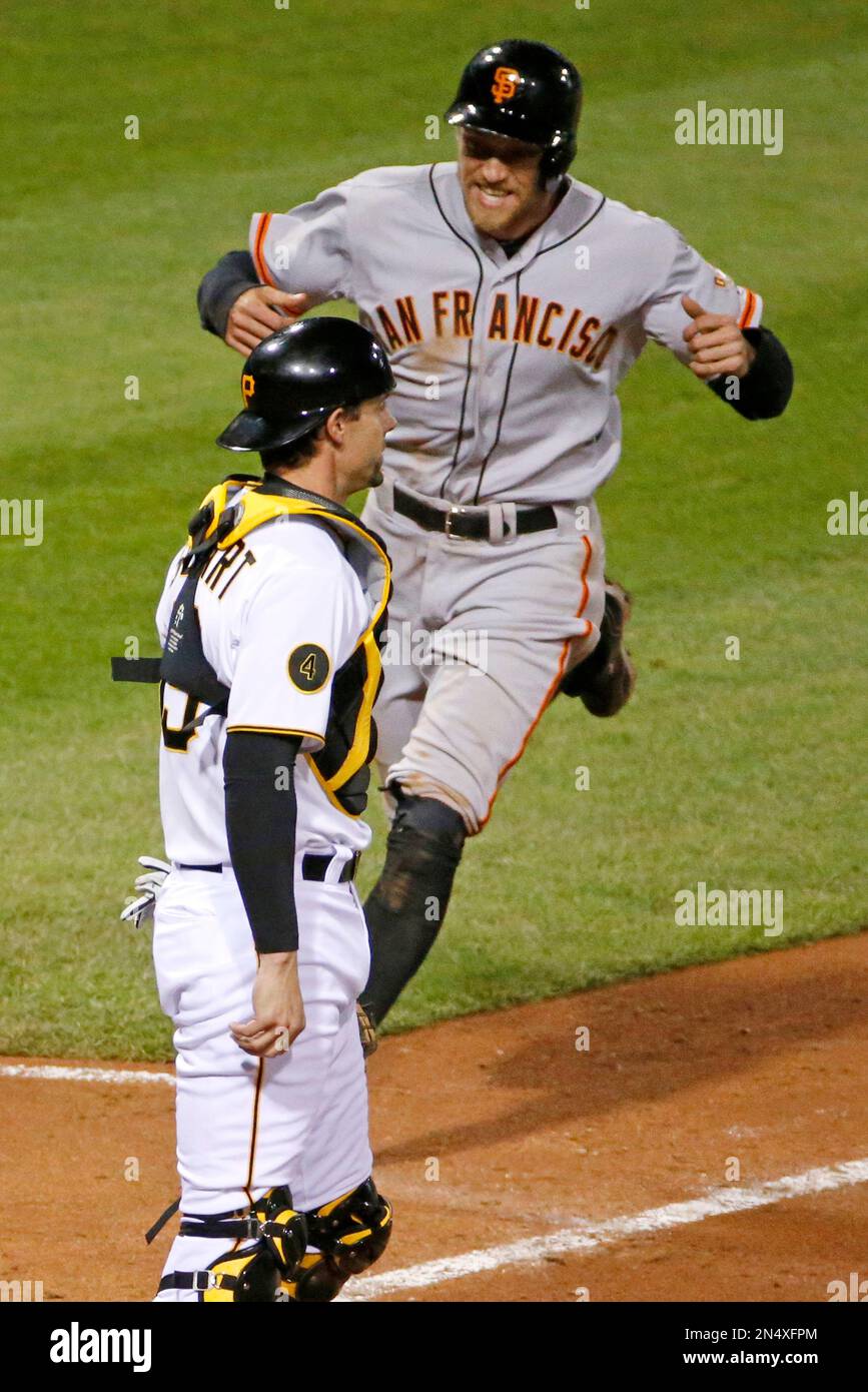San Francisco Giants' Hunter Pence, right, scores behind Pittsburgh ...