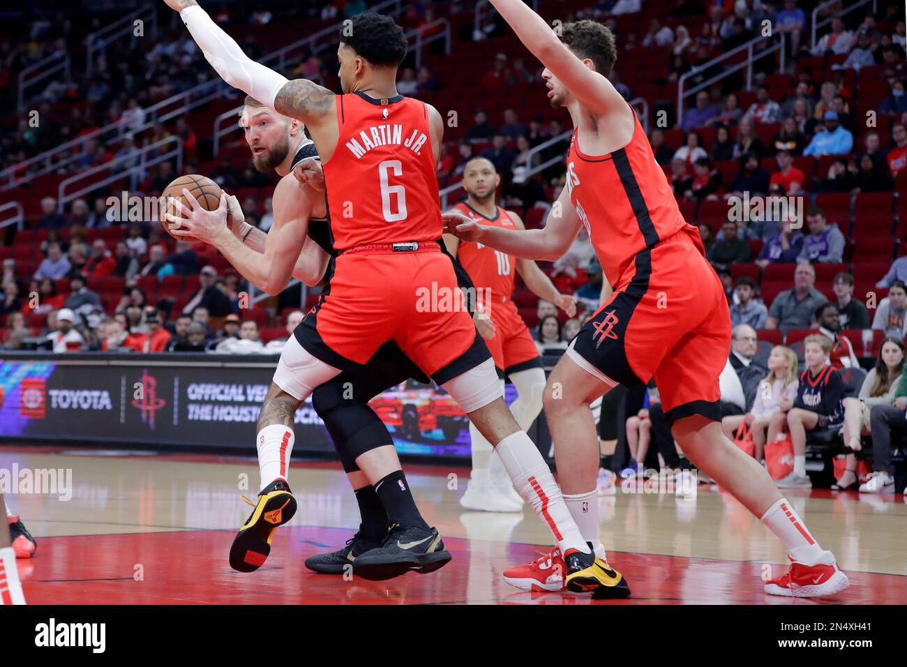 Sacramento Kings forward Domantas Sabonis, left, is defended by Houston ...