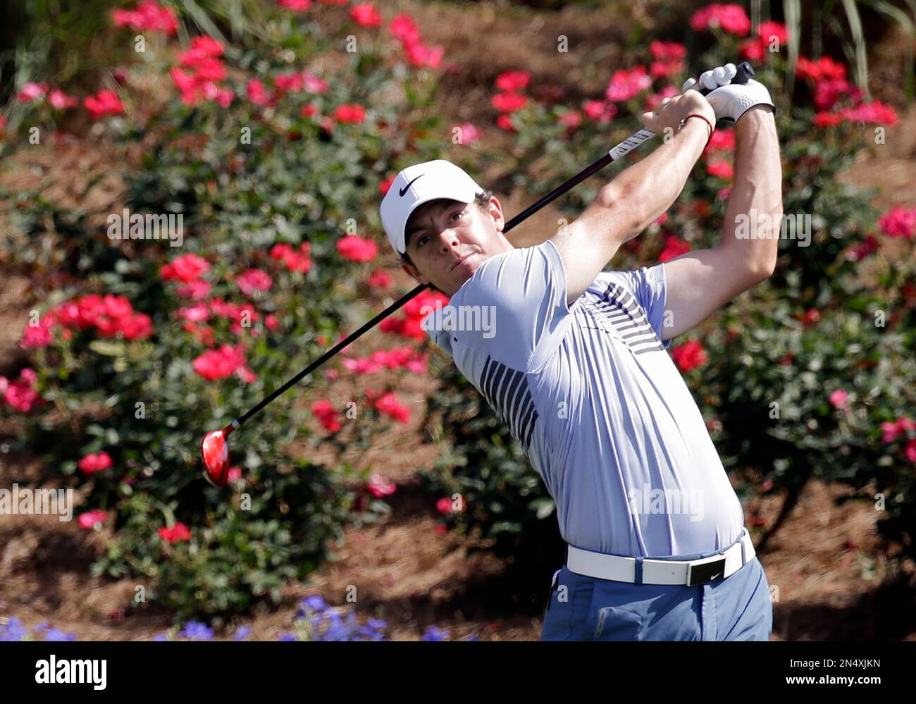 Rory McIlroy, of Northern Ireland, hits a shot from the 18th tee during ...