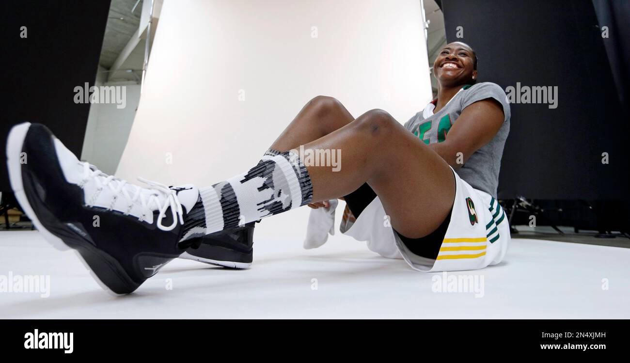 Seattle Storm's Shekinna Stricklen tugs on her shoes as she gets ready ...