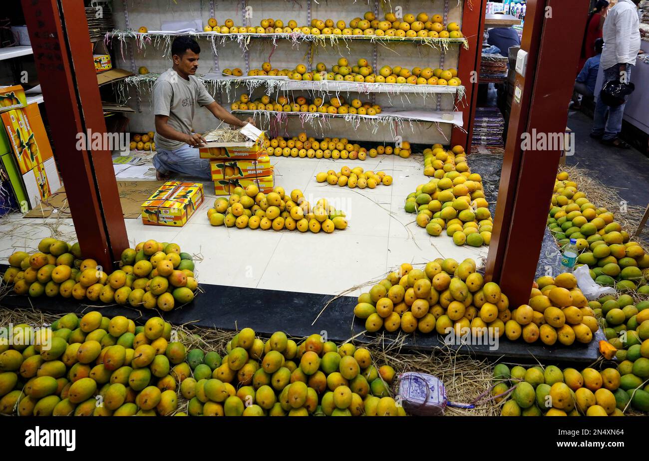 In this Tuesday, May 6, 2014 photo, an Indian vendor opens boxes of ...