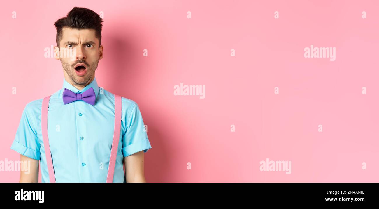 Shocked and offended young man frowning, looking at someone rude ...