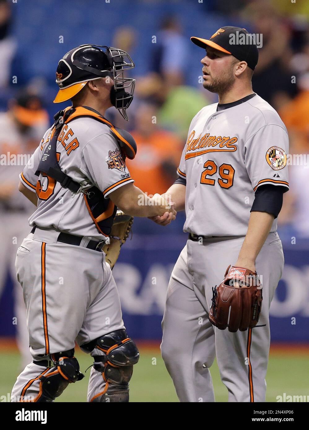 Baltimore Orioles relief pitcher Tommy Hunter, right, shakes hands with ...