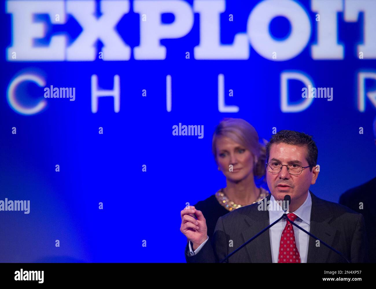 Washington Redskins NFL football team owner Dan Snyder speaks as his wife Tanya looks on during ...