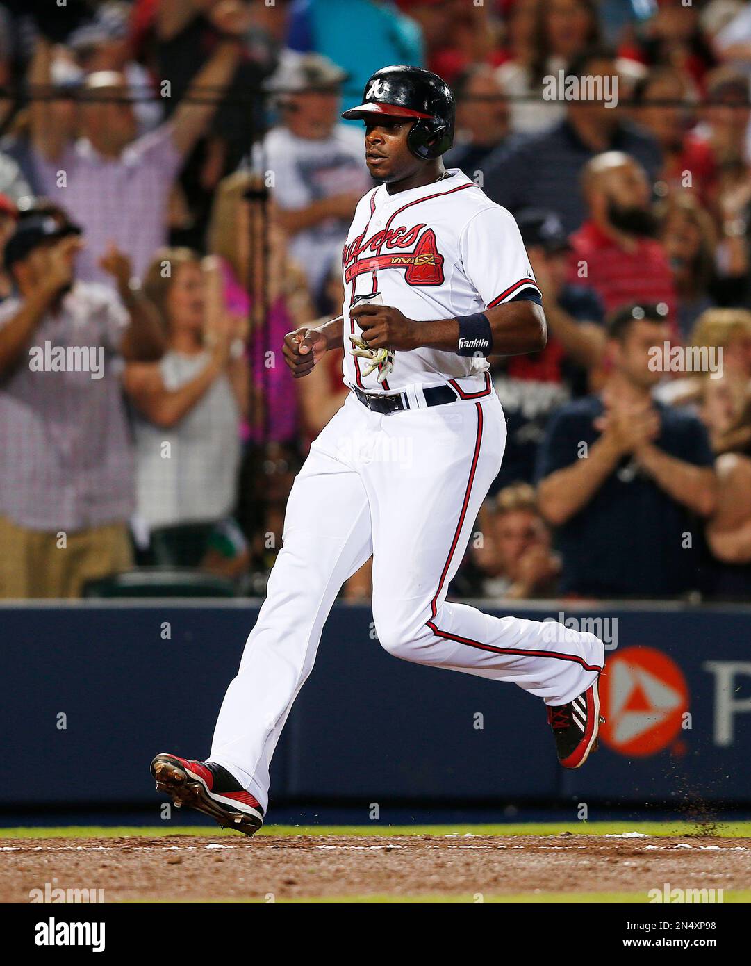 Atlanta Braves left fielder Justin Upton (8)scores on a Chris Johnson ...