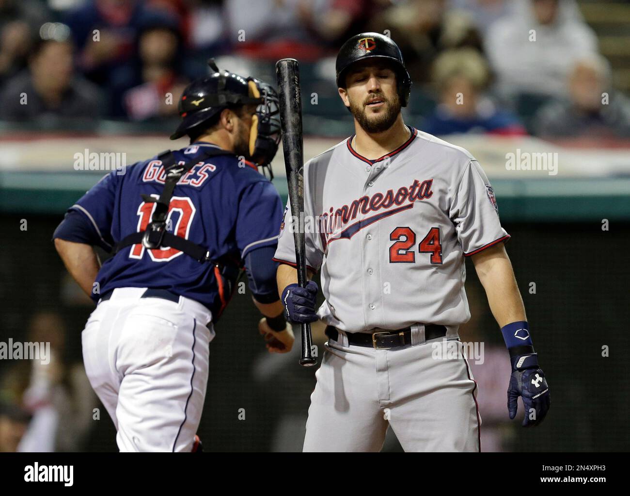 Minnesota Twins' Trevor Plouffe (24) reacts after being called out on ...
