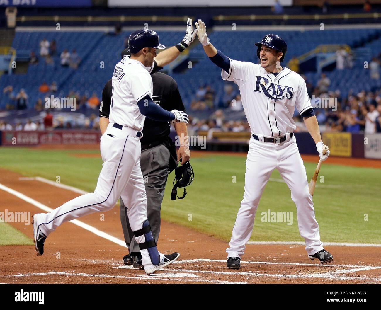 Tampa Bay Rays' Evan Longoria, left, high fives teammate Matt Joyce ...