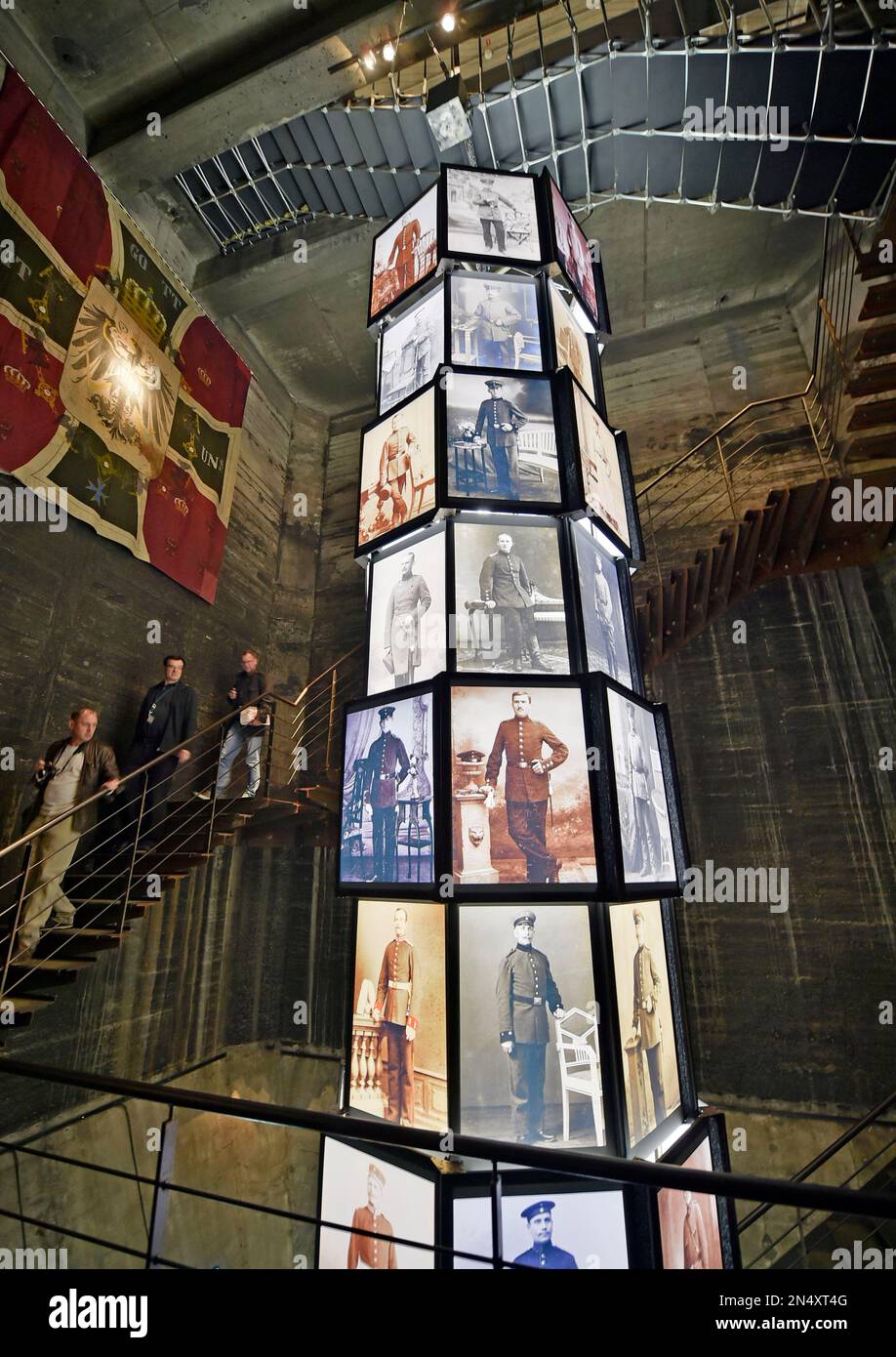 Visitors pass portraits of German World War I soldiers at the new ...