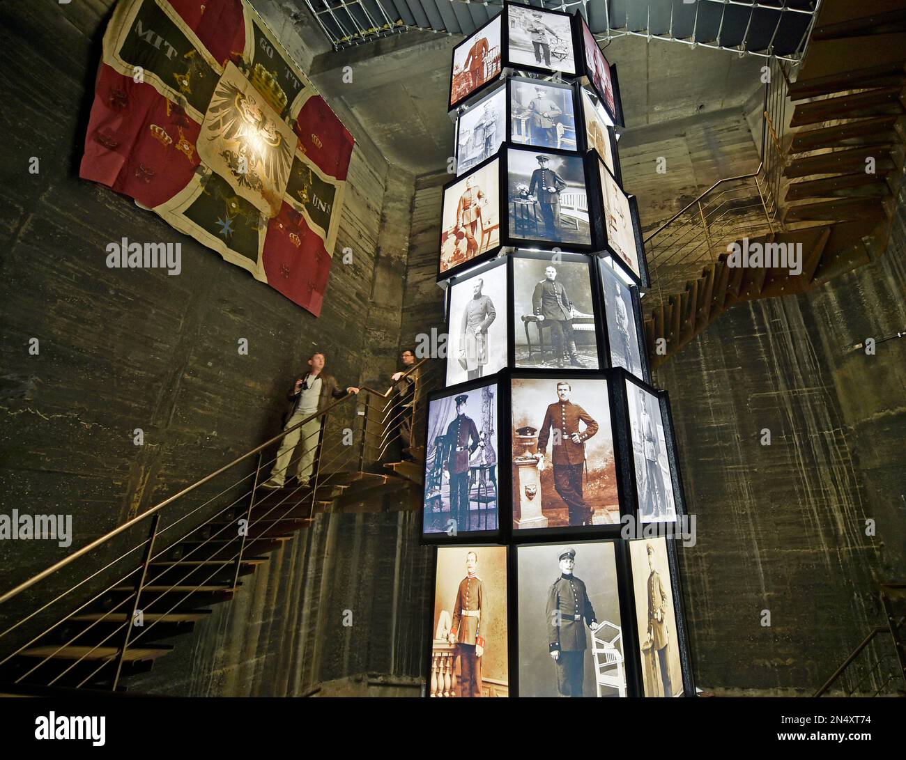 Visitors pass portraits of German World War I soldiers at the new ...